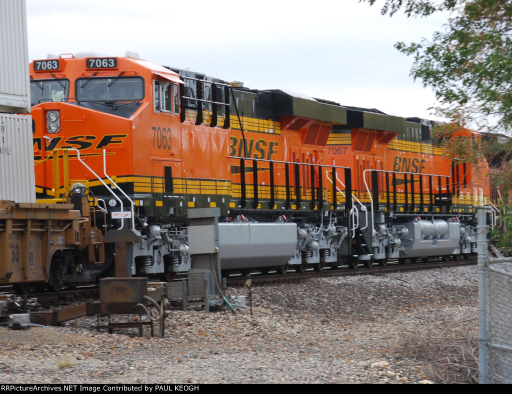 BNSF 7063 and BNSF 7067 pass me by as they Head West pulling a Stack as #4 and #3 units.